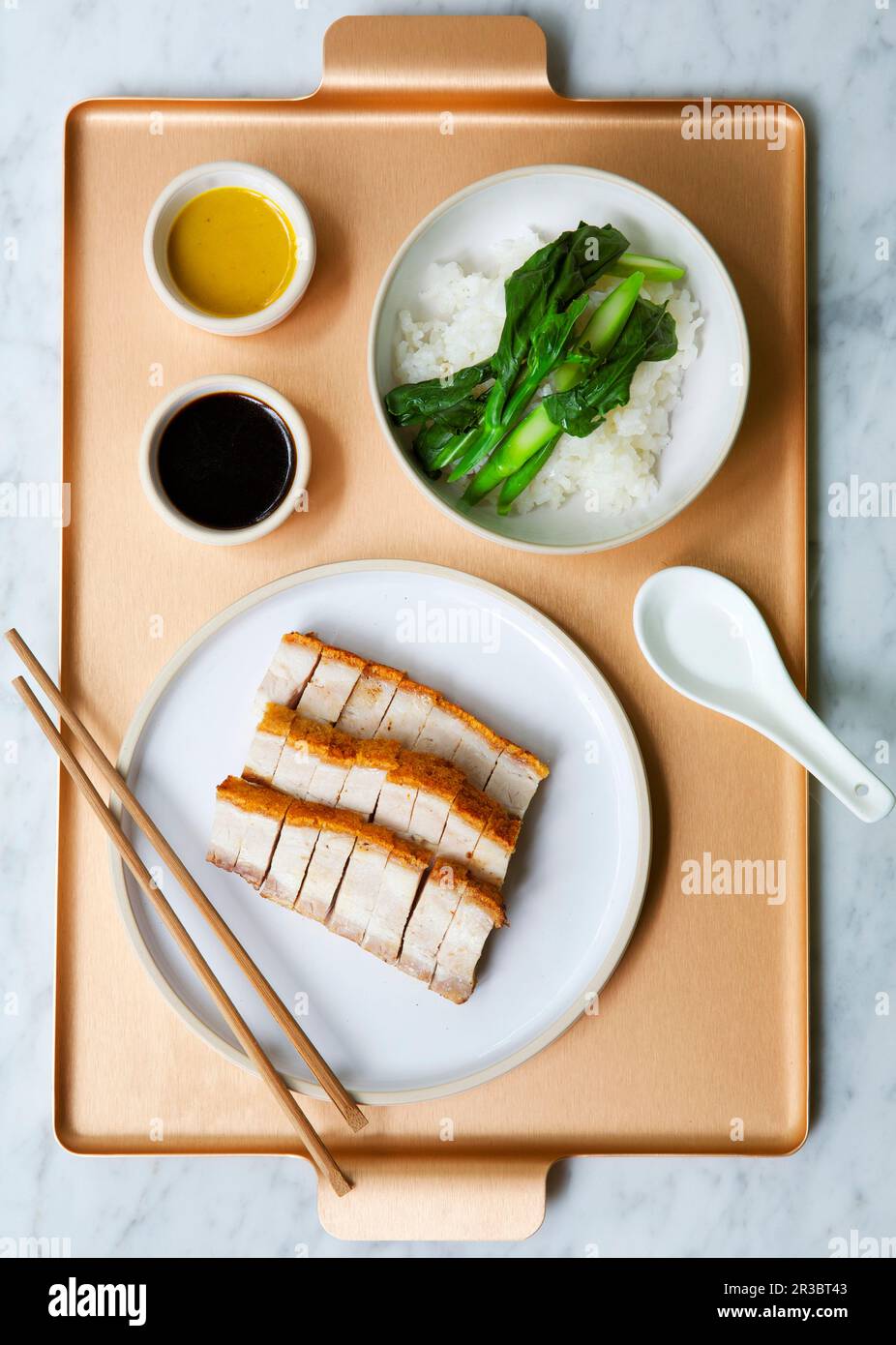 Chinese pork belly with rice and vegetables on a tray Stock Photo - Alamy