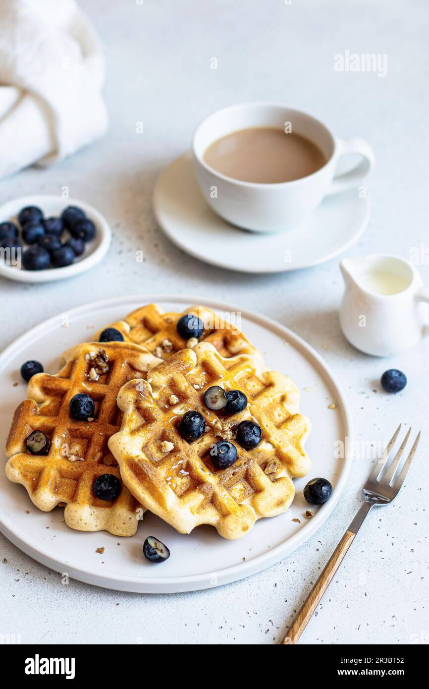 Belgian waffles with blueberries for coffee Stock Photo - Alamy