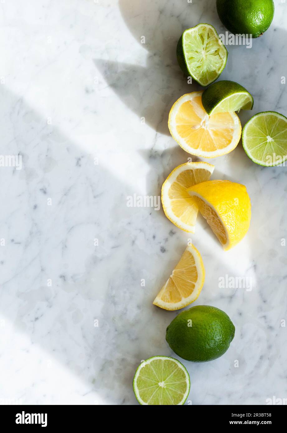 Lemons and limes, whole, halved and slices Stock Photo - Alamy