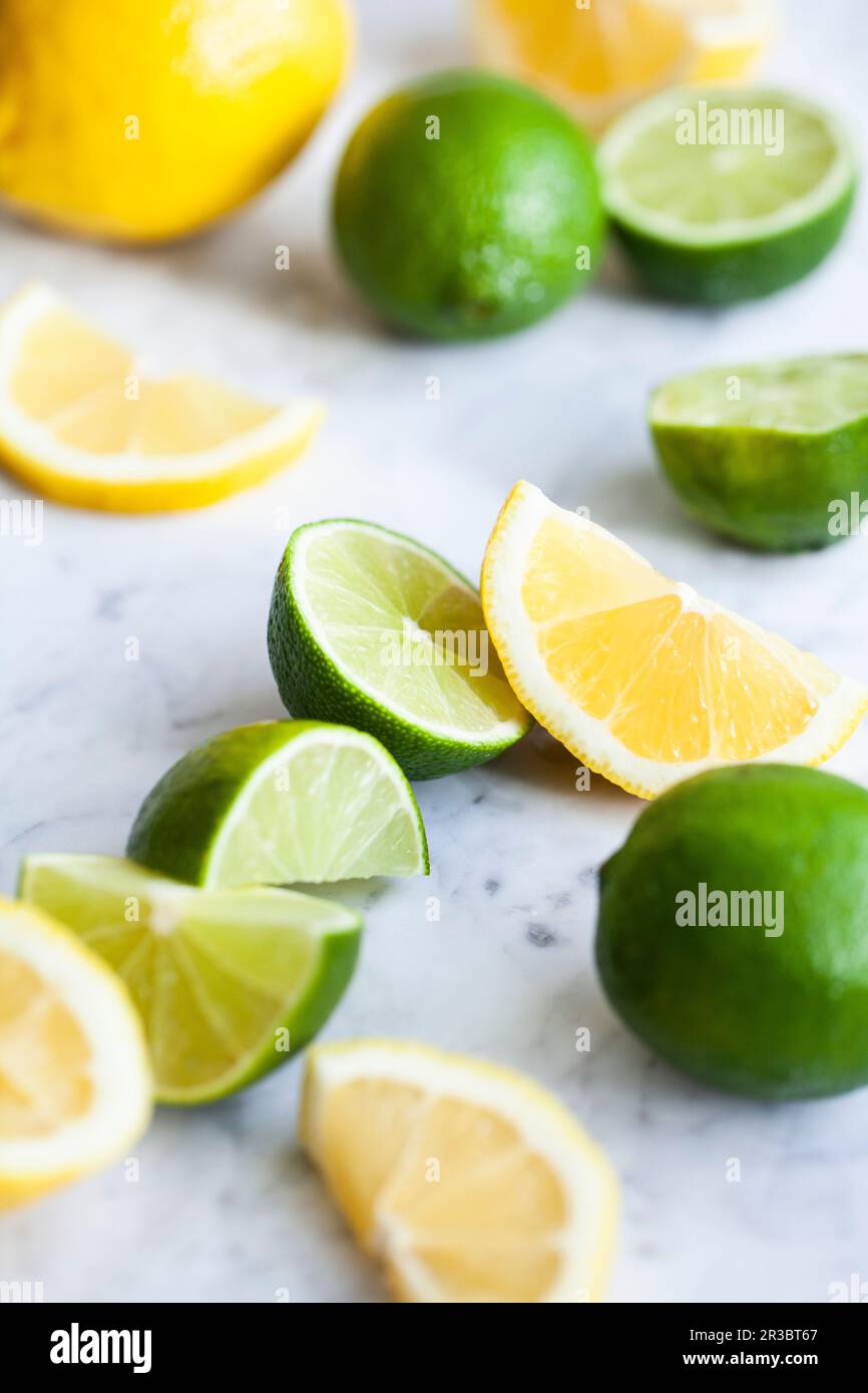 Lemons and limes, whole, halved and slices Stock Photo - Alamy