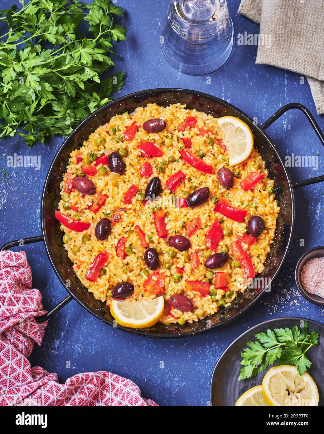 Spanish vegetable paella with peppers and olives Stock Photo - Alamy
