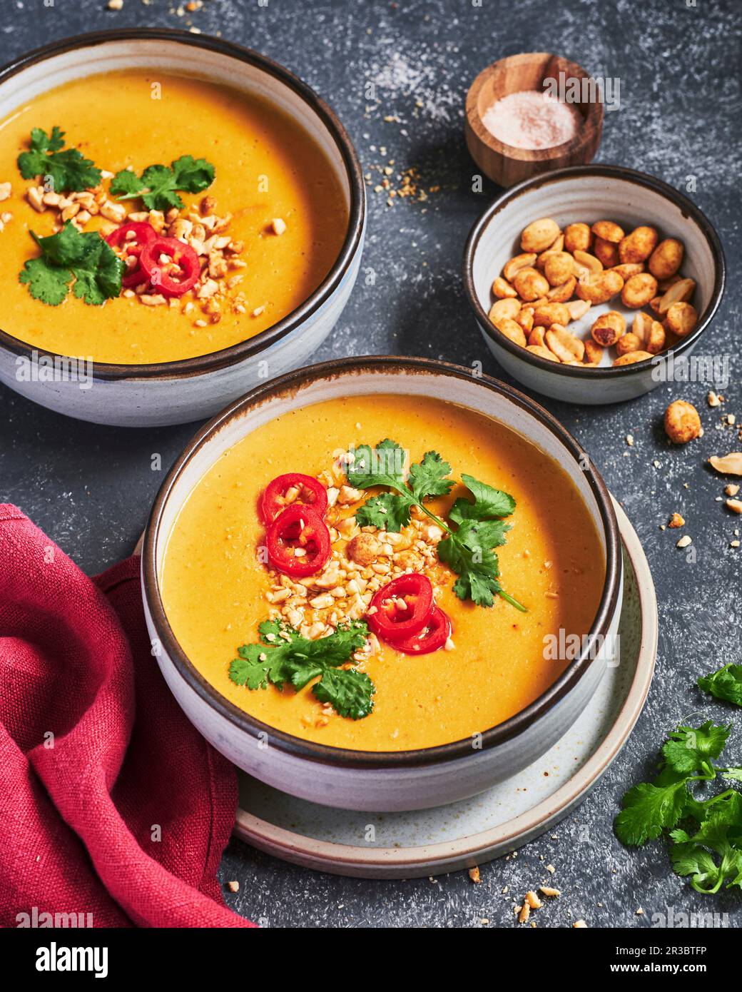 Pumpkin soup with peanuts Stock Photo - Alamy