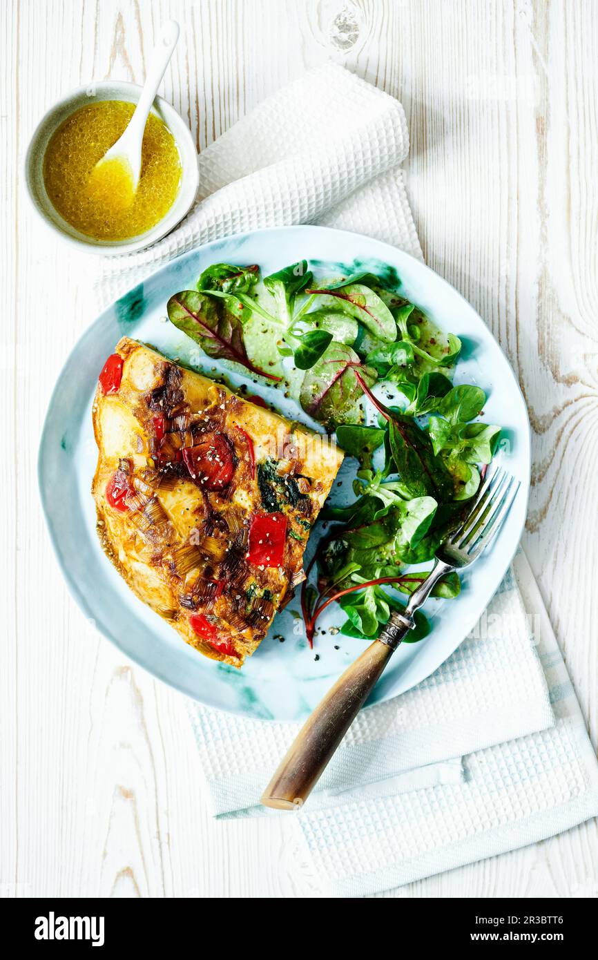 Red snapper and spinach tortilla Stock Photo - Alamy