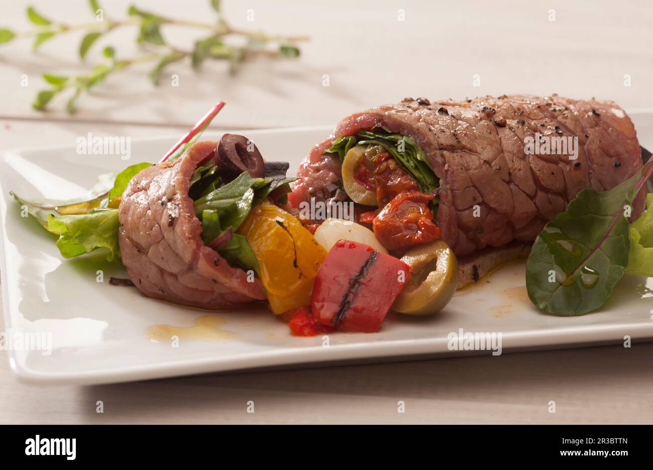 Beef roulade filled with Mediterranean vegetables Stock Photo - Alamy