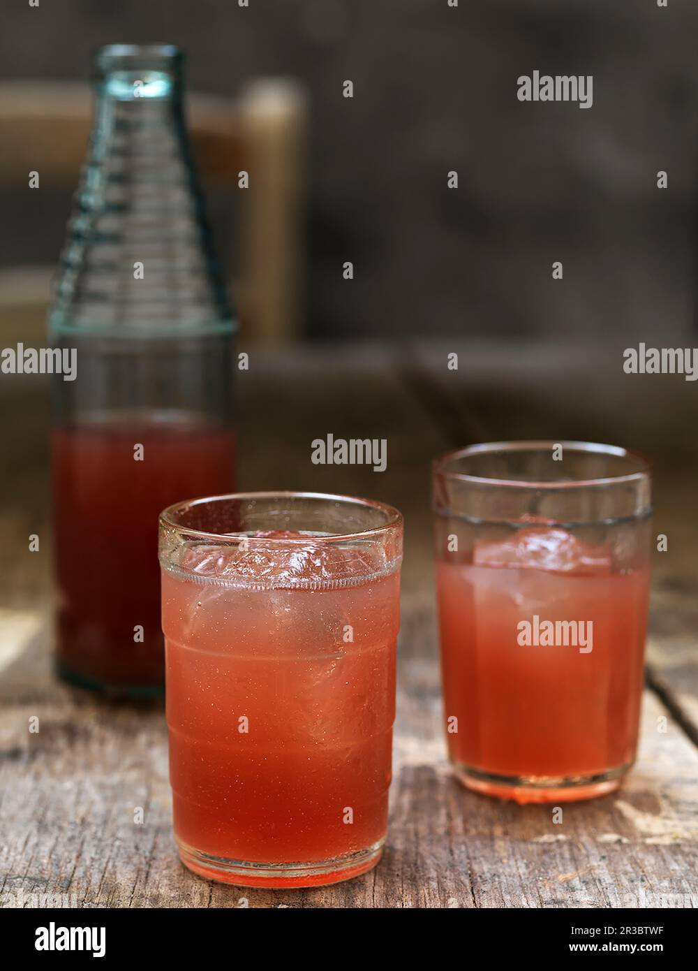 Fruit juice cocktails with ice cubes Stock Photo - Alamy