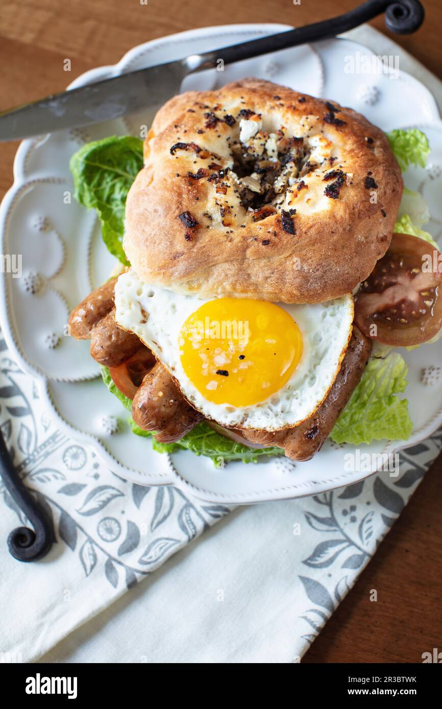 Bialys with Goat Cheese and Onions with an egg ans sausage Stock Photo ...