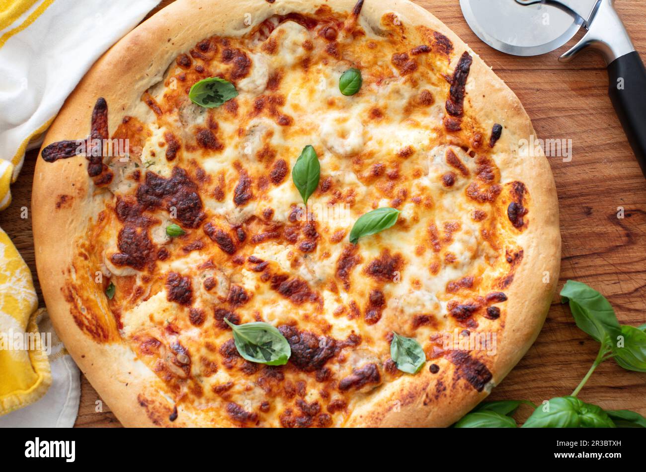Cheese pizza with bazil Stock Photo - Alamy