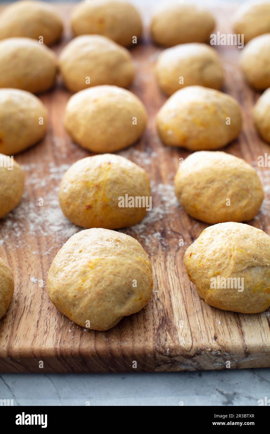 Honey Rolls with Saffron and spelt flour before baking Stock Photo - Alamy