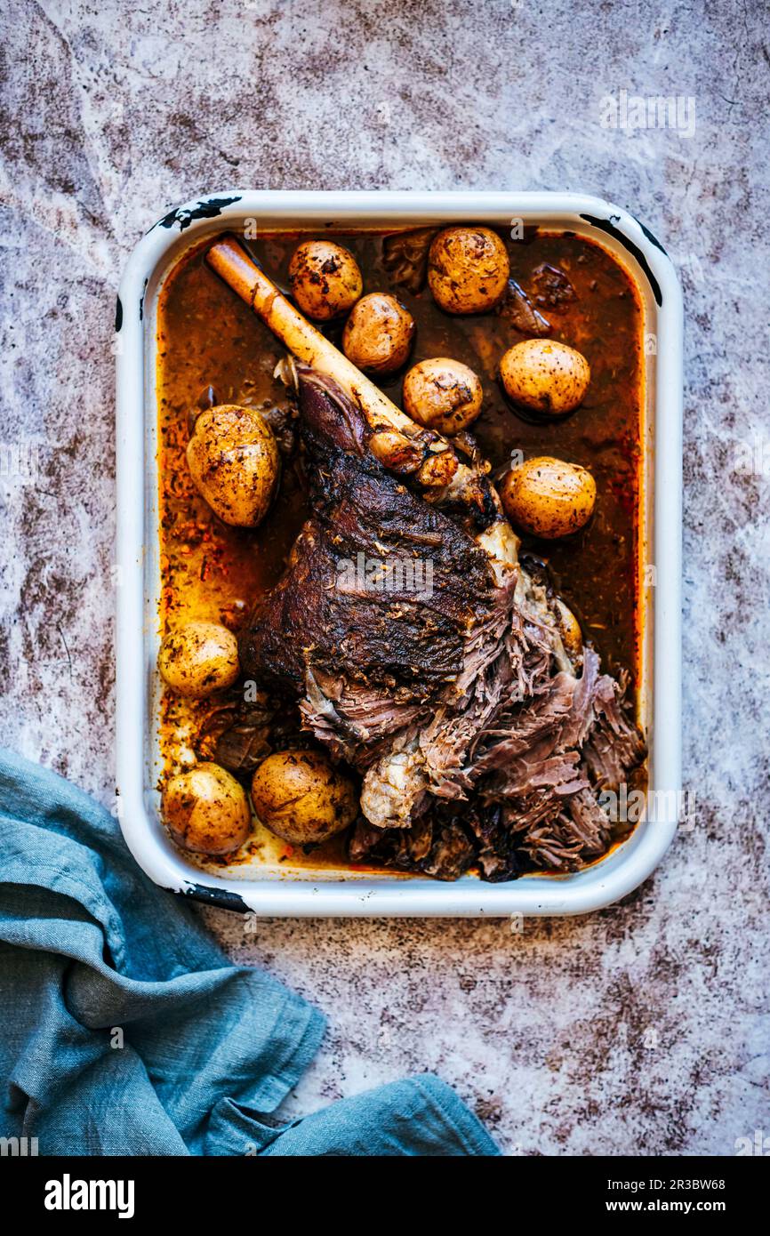 Paprika leg of lamb with baby potatoes Stock Photo - Alamy