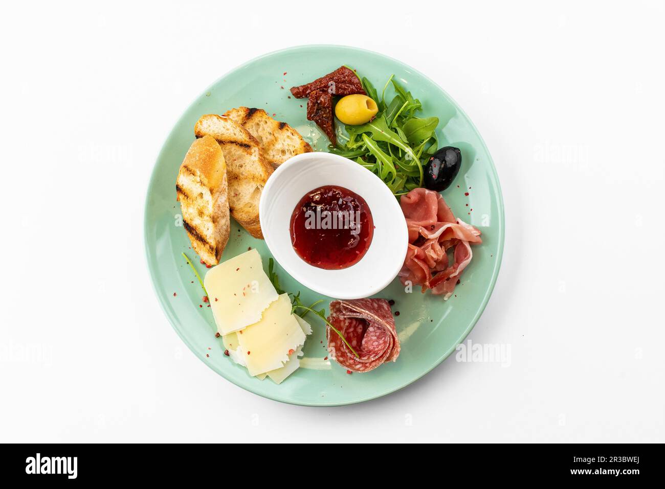 Antipasti plate - ham, salami, croutons, jam and cheese Stock Photo - Alamy