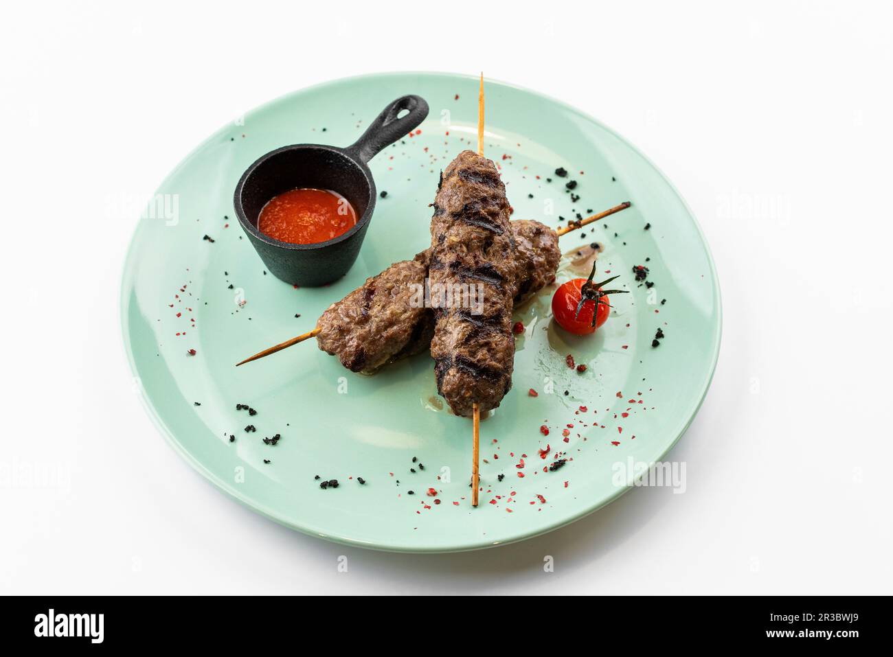 Turkish kebab with tomato sauce Stock Photo - Alamy