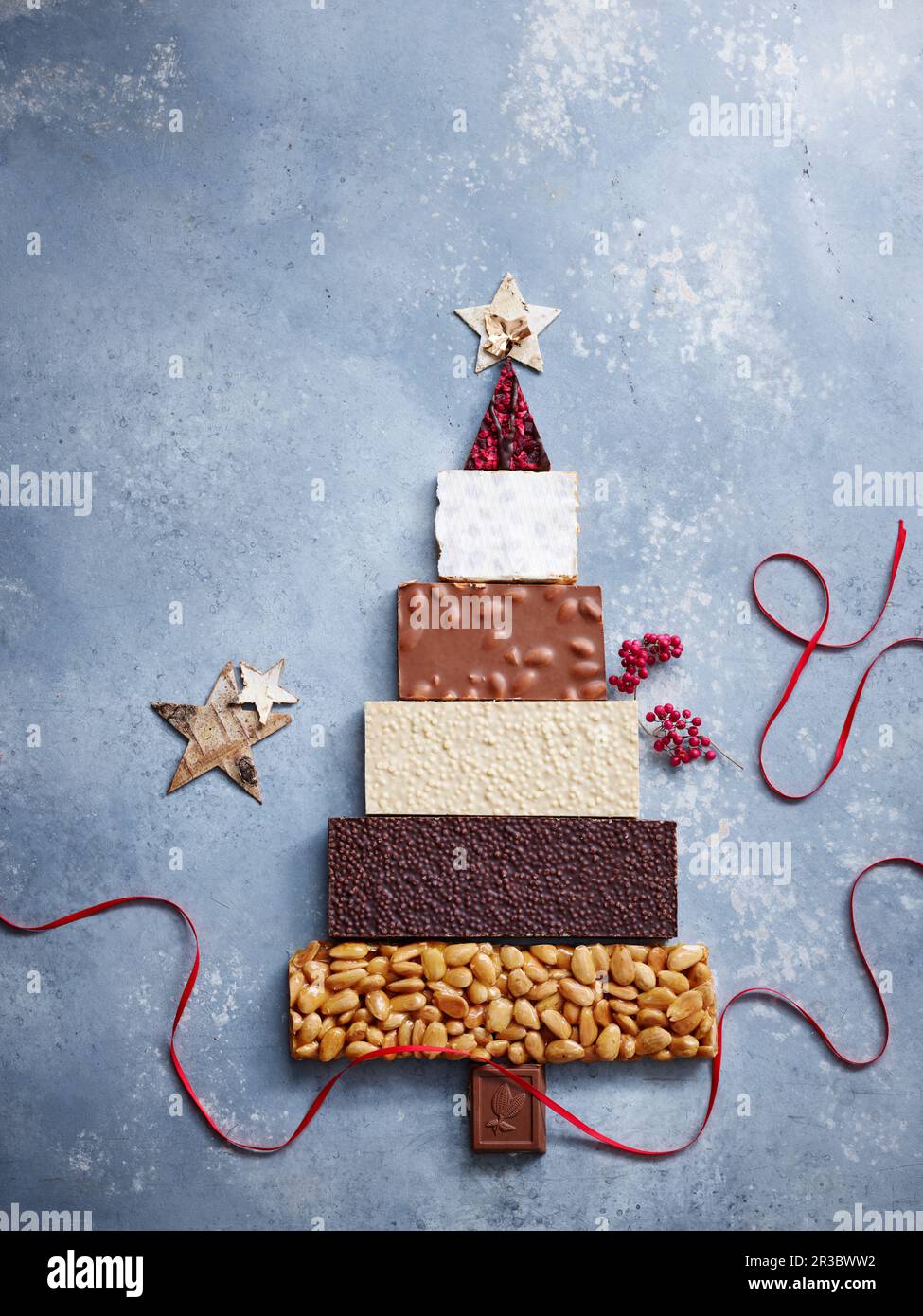 Christmas tree built of different chocolate bars Stock Photo - Alamy