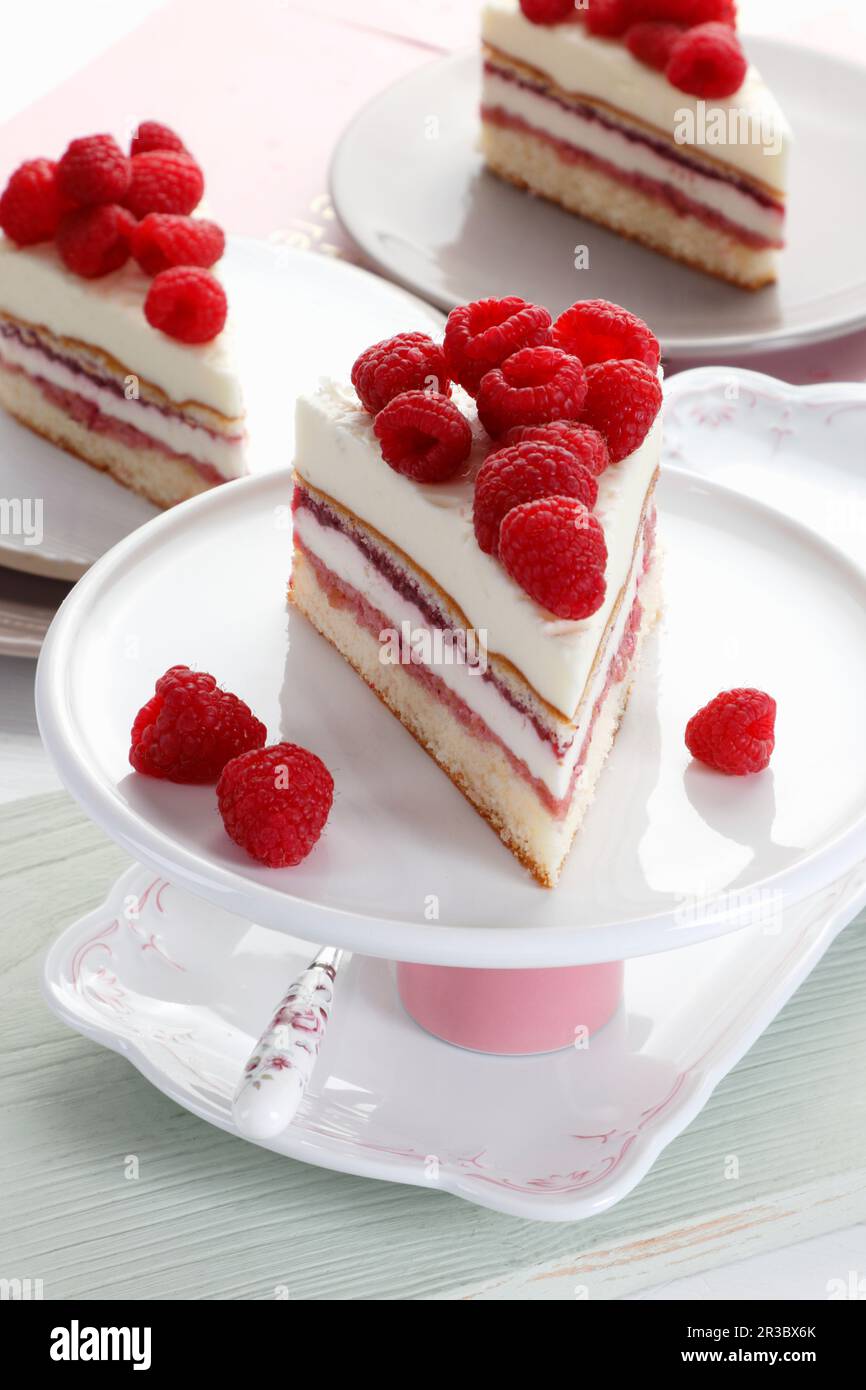 Raspberry and creamy layered cake Stock Photo - Alamy