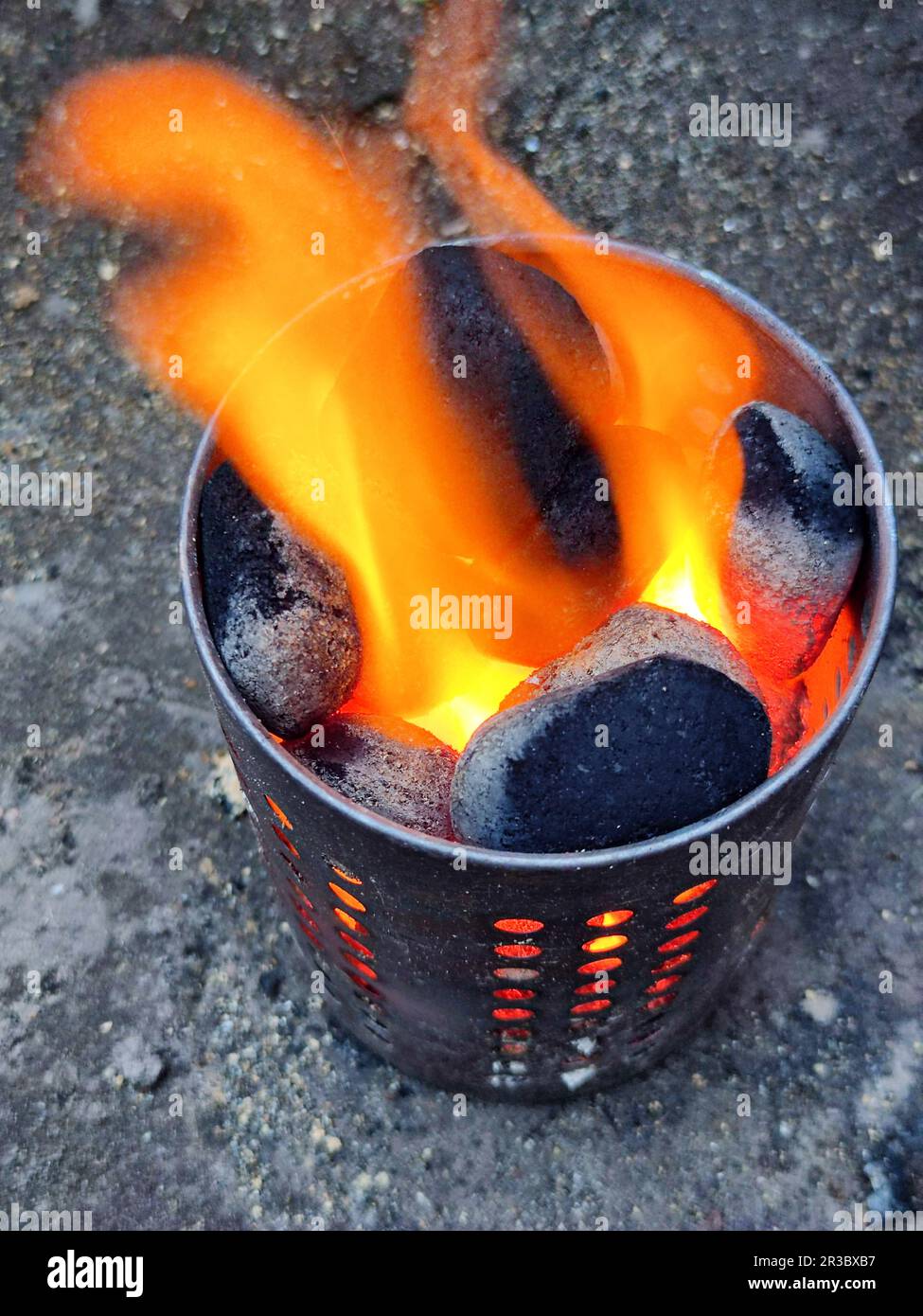 Lit coal briquettes Stock Photo - Alamy