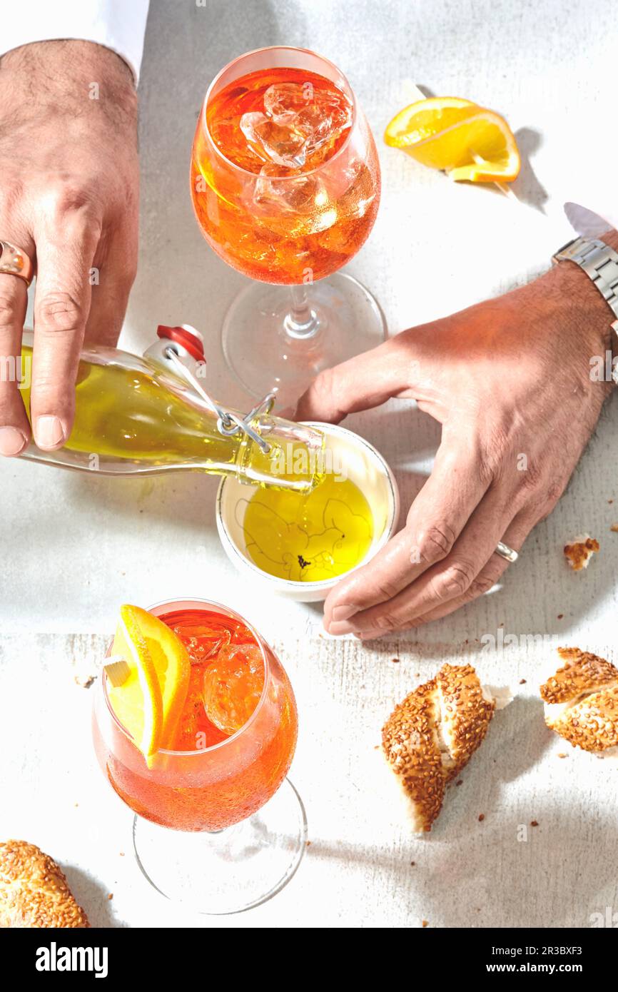 Aperol Spritz with bread and oil Stock Photo - Alamy