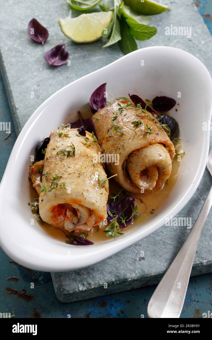 Baked pike fillet roll Stock Photo - Alamy