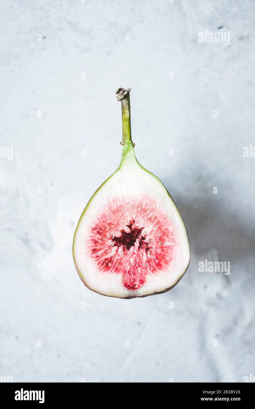 Fresh fig cut in half Stock Photo - Alamy