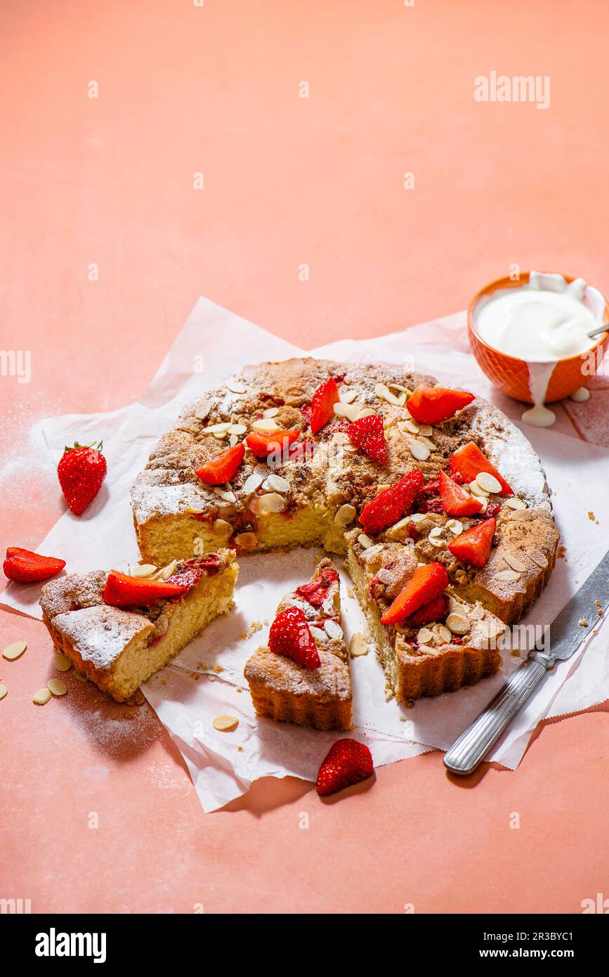 Almond sponge with strawberries and crumble topping Stock Photo - Alamy