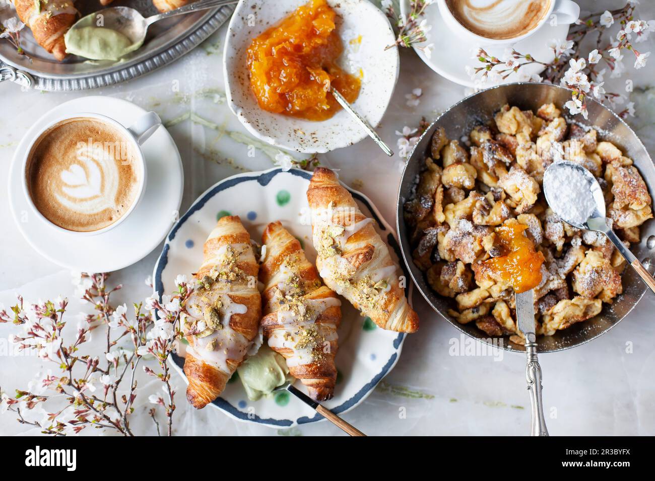Brunch table of Scrambled pancakes (Kaiserschmarrn), almond croissants ...
