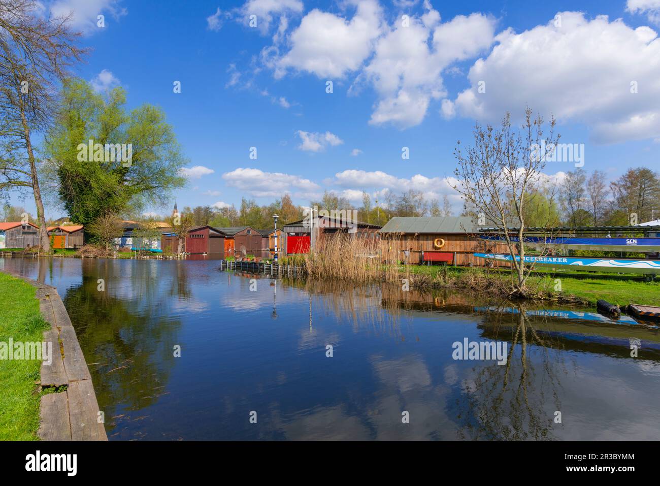 Traditional boat houses along the river Oberbach, town Neubrandenbrug ...