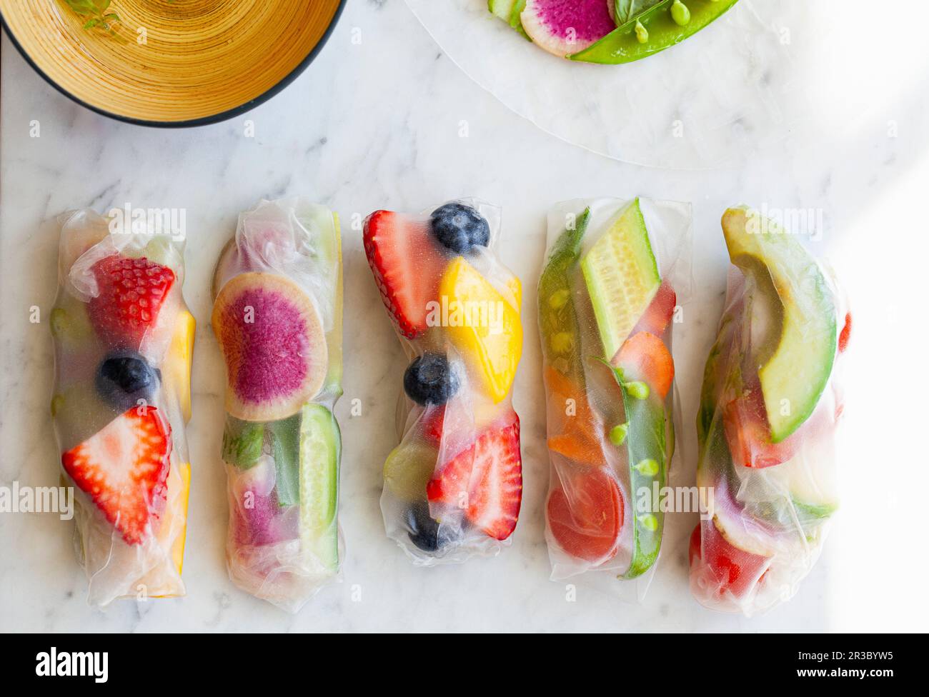 Raw fruit and vegetable spring rolls Stock Photo - Alamy
