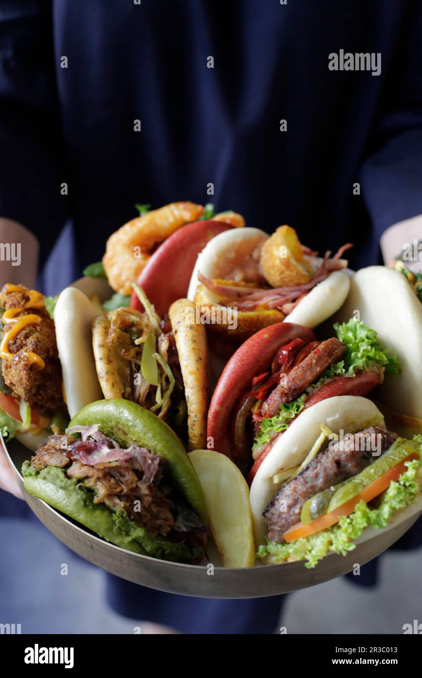 Serving variety of Gua bao buns Stock Photo - Alamy