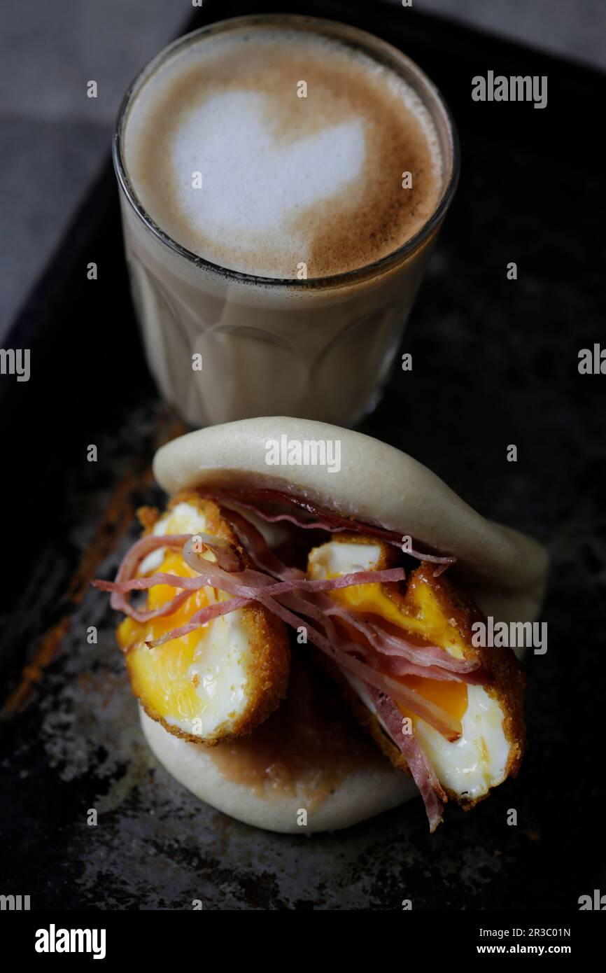 Breakfast bun with egg and ham (Bao bun Stock Photo - Alamy