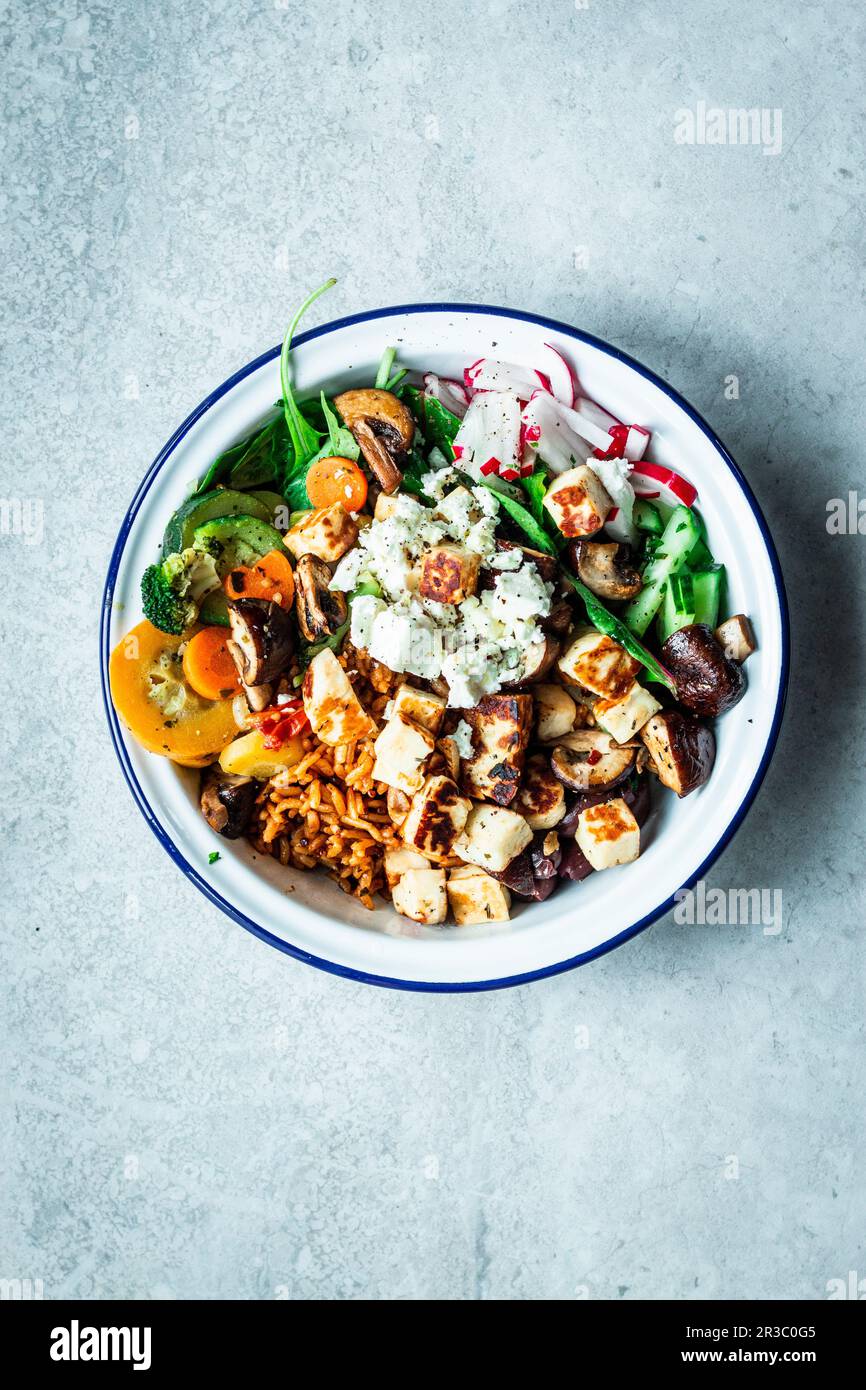 Quick bowl with rice, mushrooms and halloumi Stock Photo - Alamy