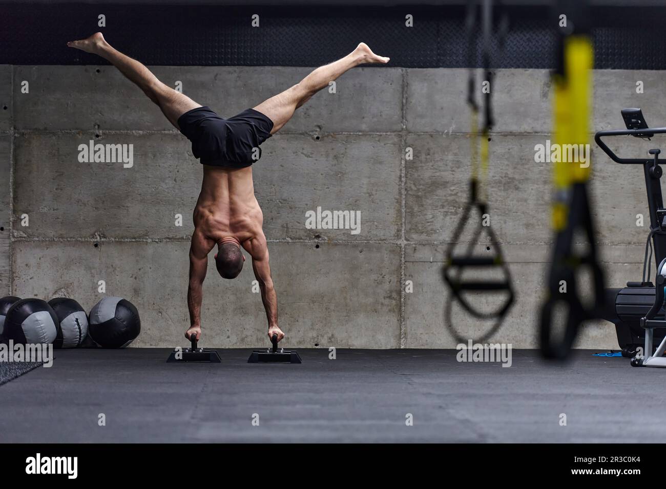 A muscular man in a handstand position, showcasing his exceptional ...