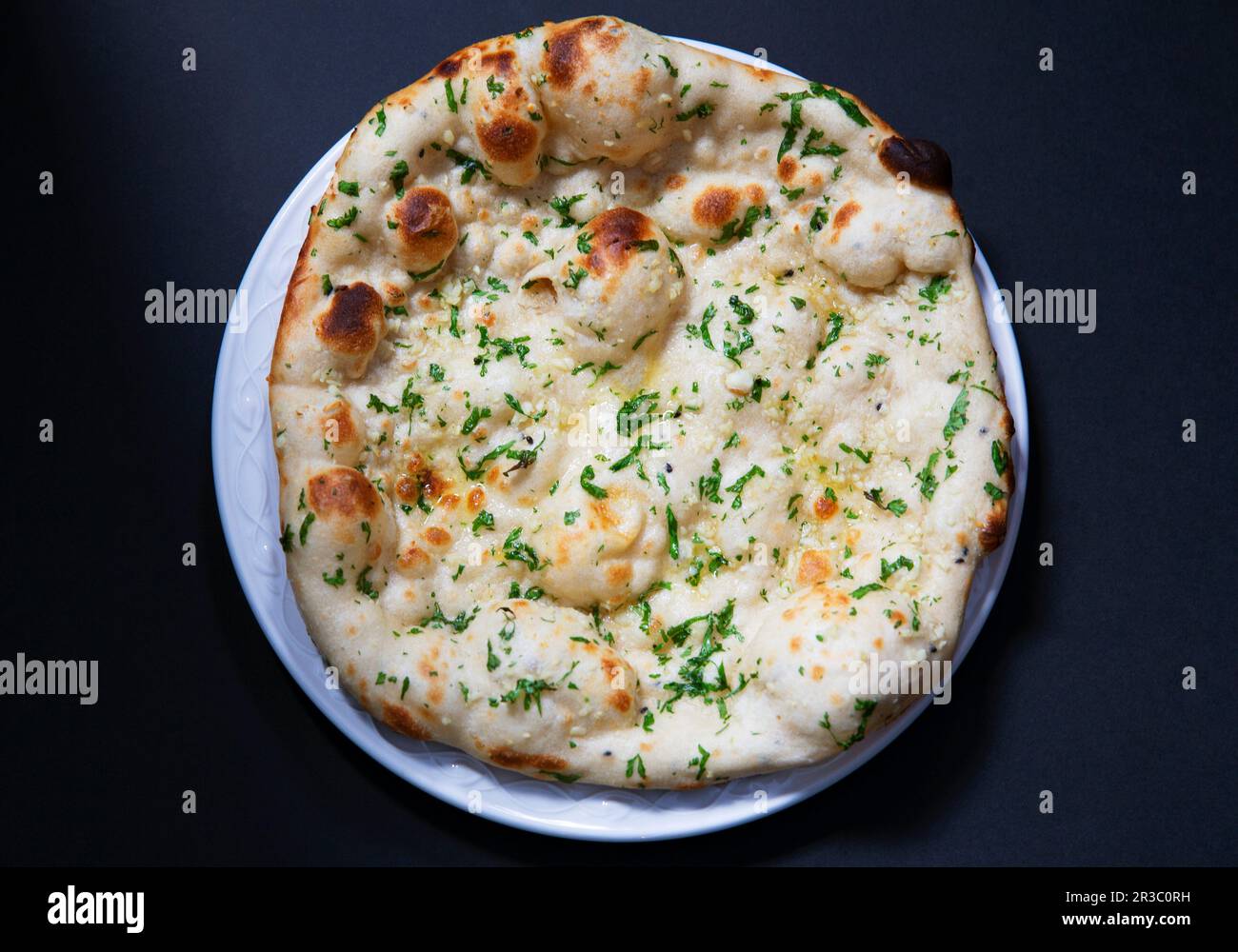 Indian naan bread with garlic Stock Photo - Alamy