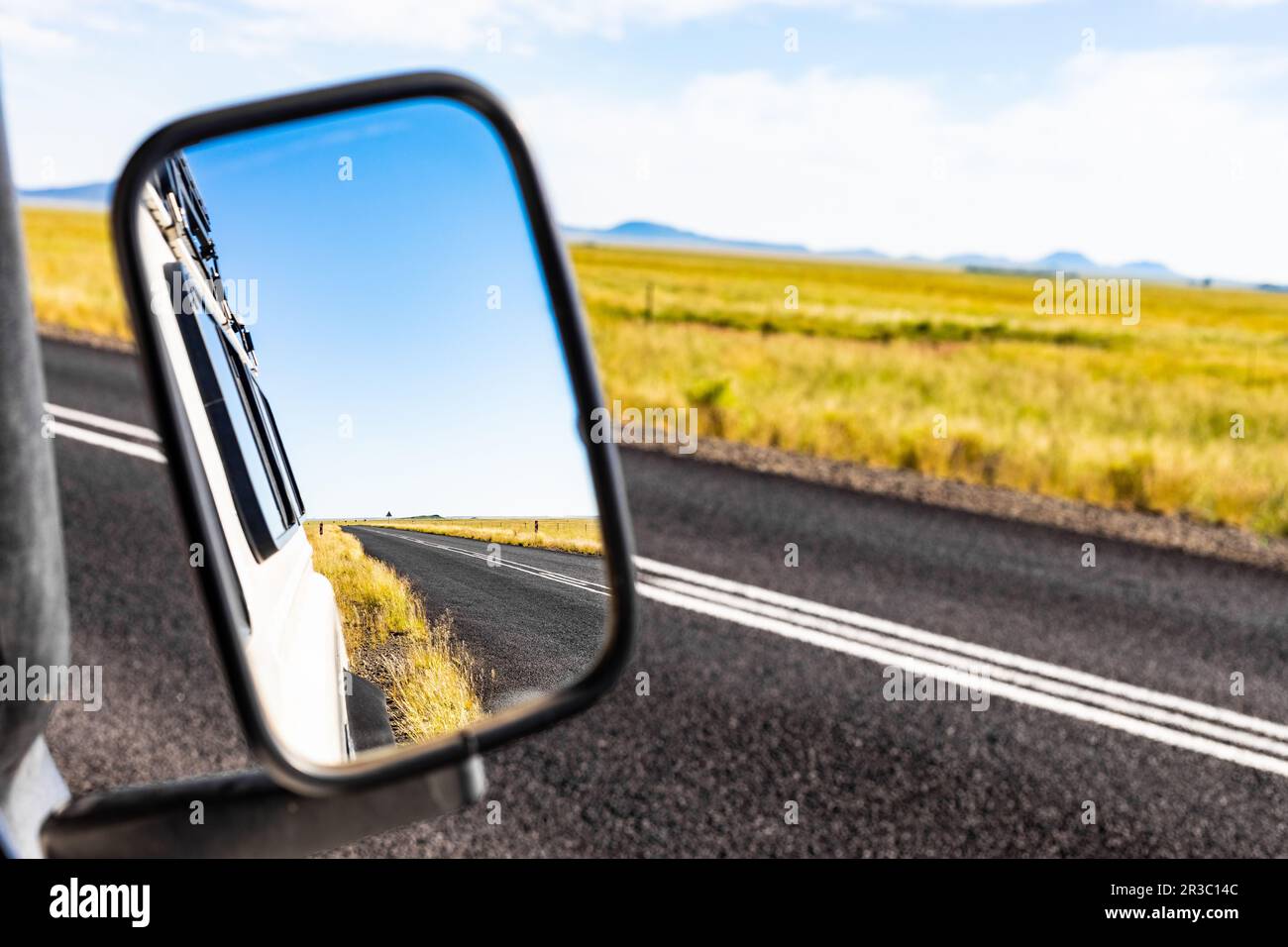 Rear view in a side Mirror of 4x4 vehicle Stock Photo - Alamy