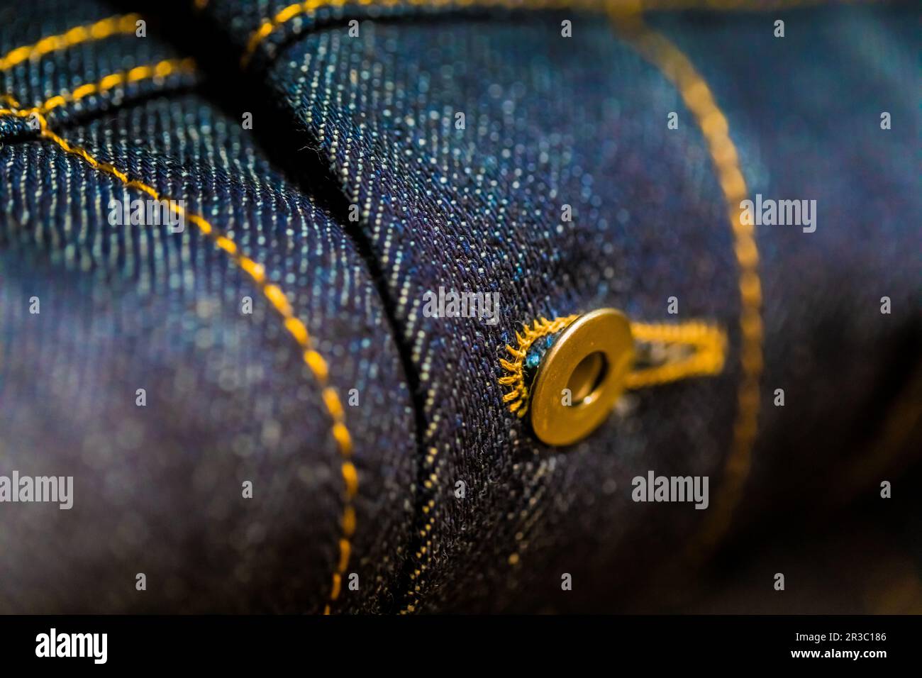 Blue and Yellow Denim with stitching Stock Photo - Alamy