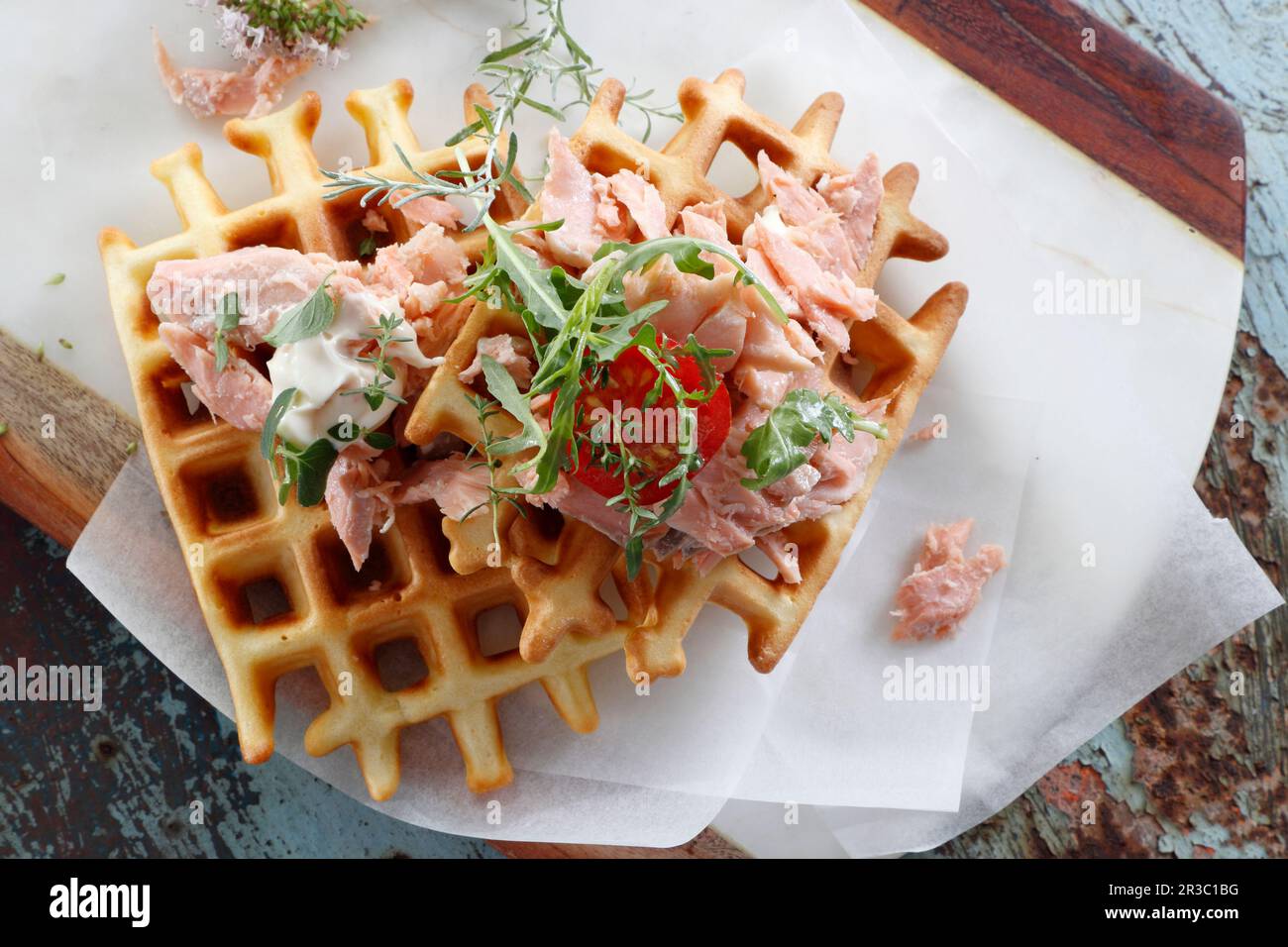 Light waffles with steamed salmon Stock Photo - Alamy