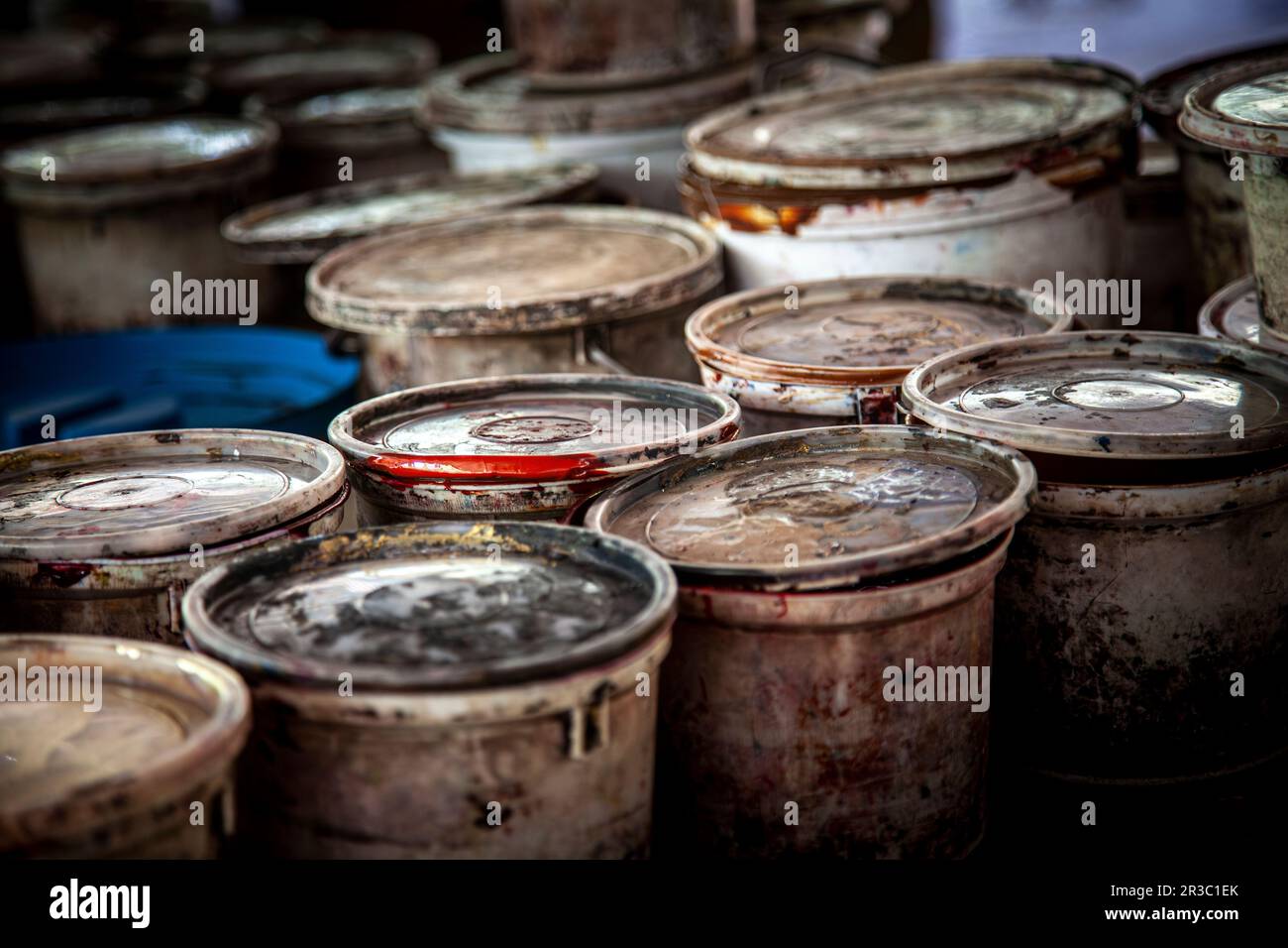 old plastic paint cans background Stock Photo - Alamy