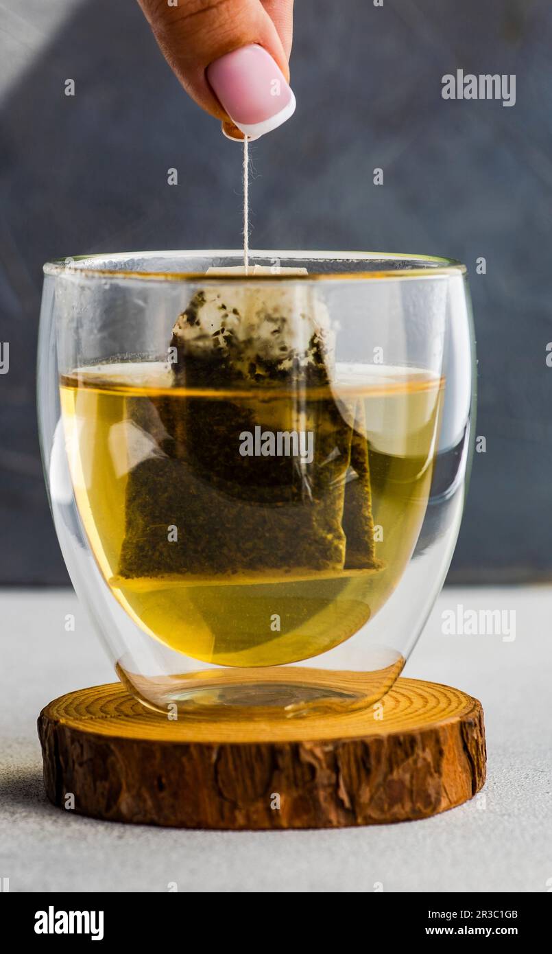 Woman hand teabag hi-res stock photography and images - Alamy