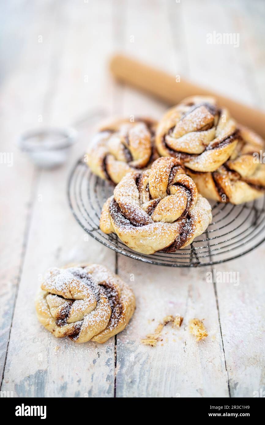 Yeast dough rings with a nougat filling Stock Photo - Alamy