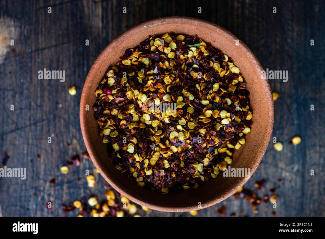 Organic pepper spice on rustic background Stock Photo - Alamy