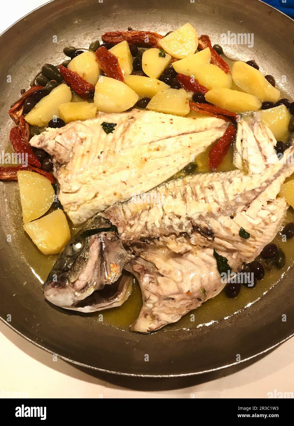 Baked sea bream Italian style Stock Photo - Alamy