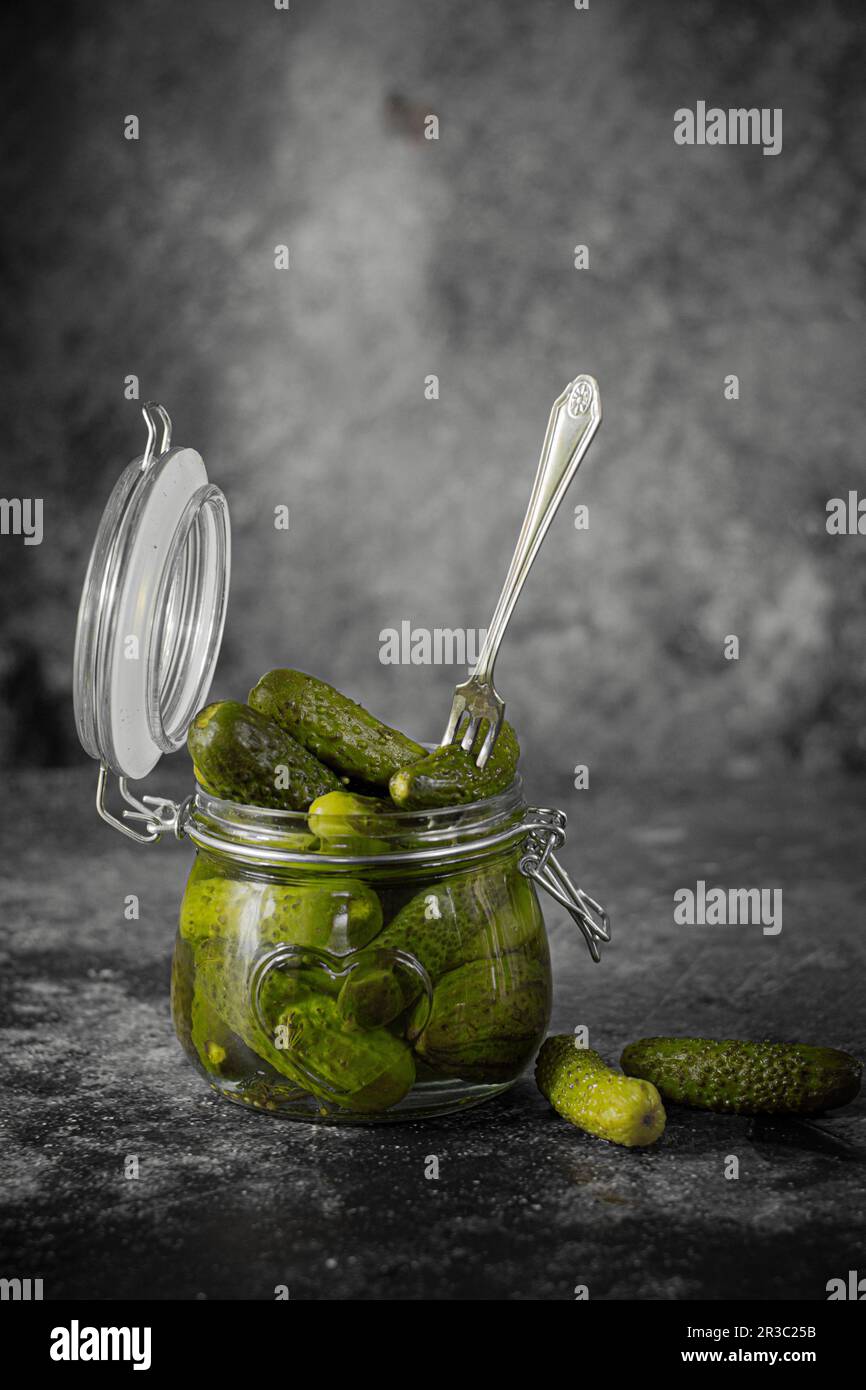Pickled cucumbers in a jar Stock Photo - Alamy