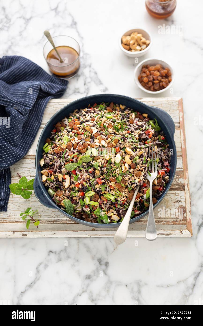 Rice salad with sunflower seeds, cashew nuts and sultanas Stock Photo ...