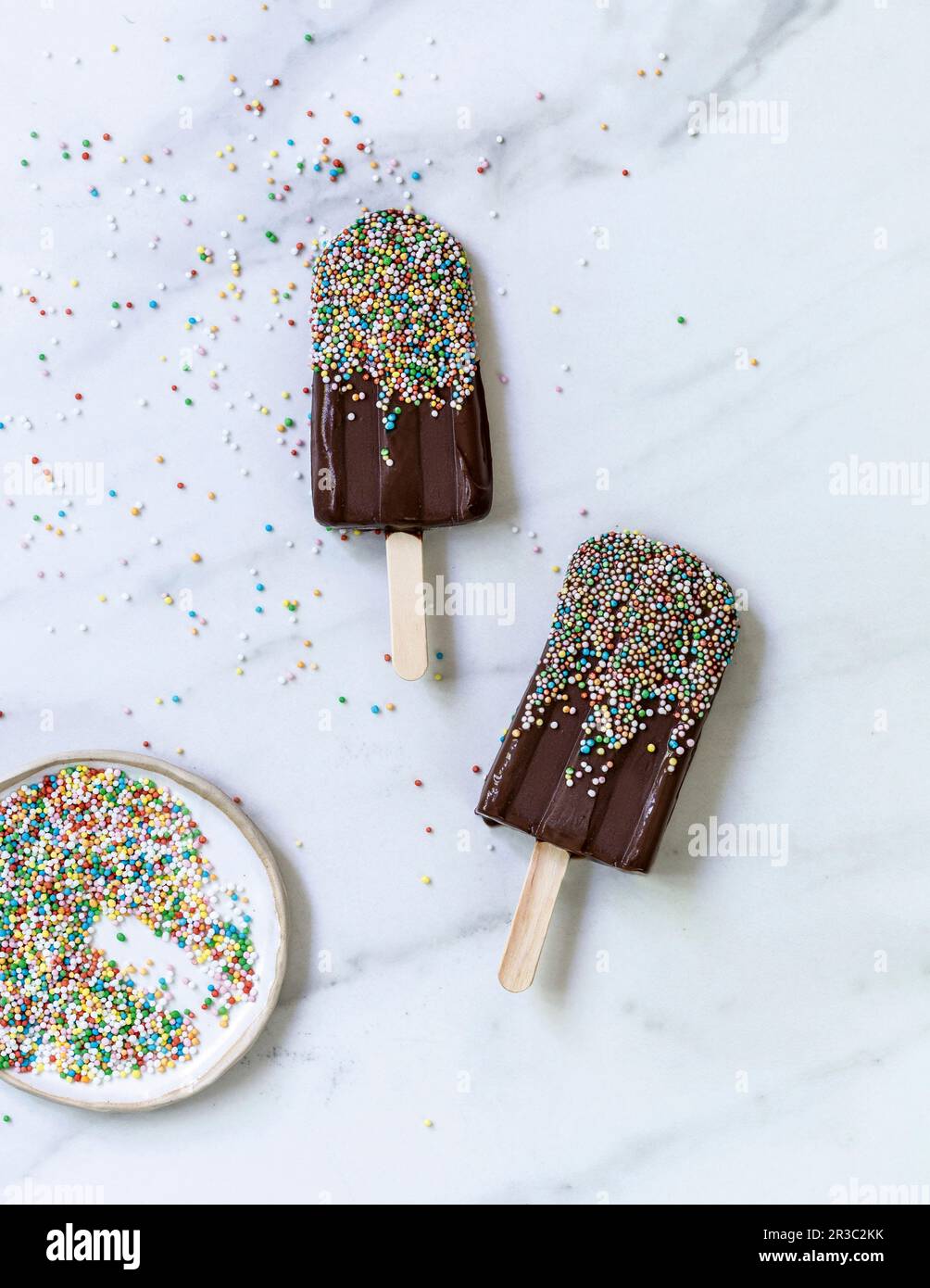 Chocolate ice cream sticks with coloured sugar sprinkles Stock Photo ...