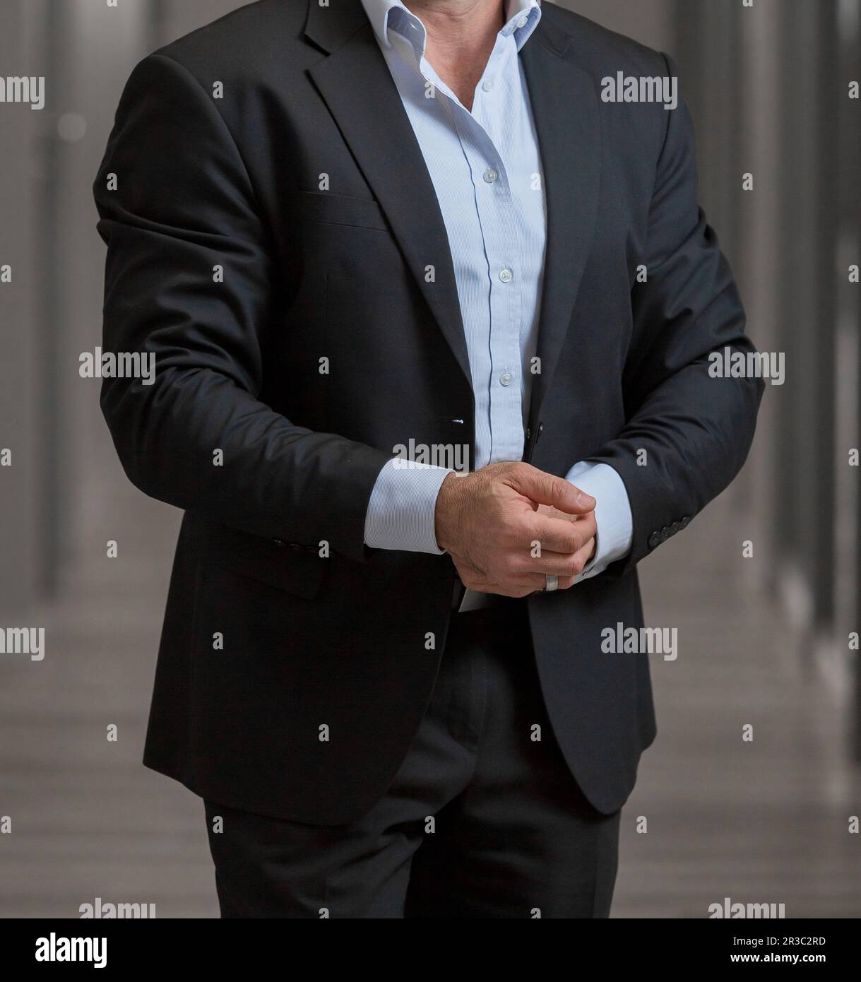 Cropped head Man standing in a smart suit Stock Photo - Alamy