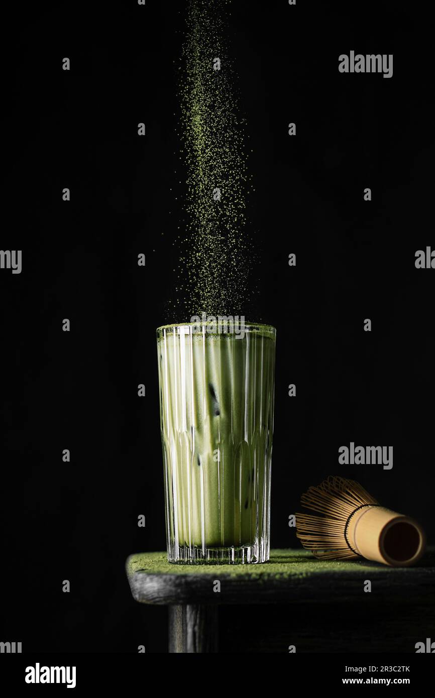Matcha latte on black background Stock Photo - Alamy