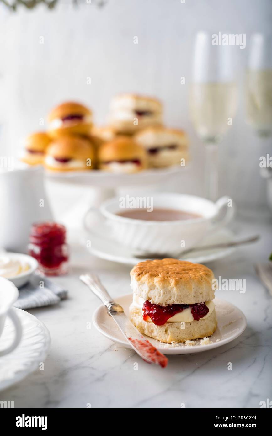 Afternoon tea with scone with cream and jam Stock Photo - Alamy