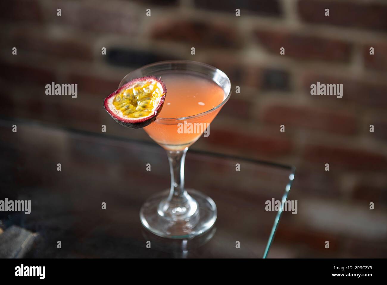 Passion fruit cocktail with a slice of passion fruit Stock Photo - Alamy