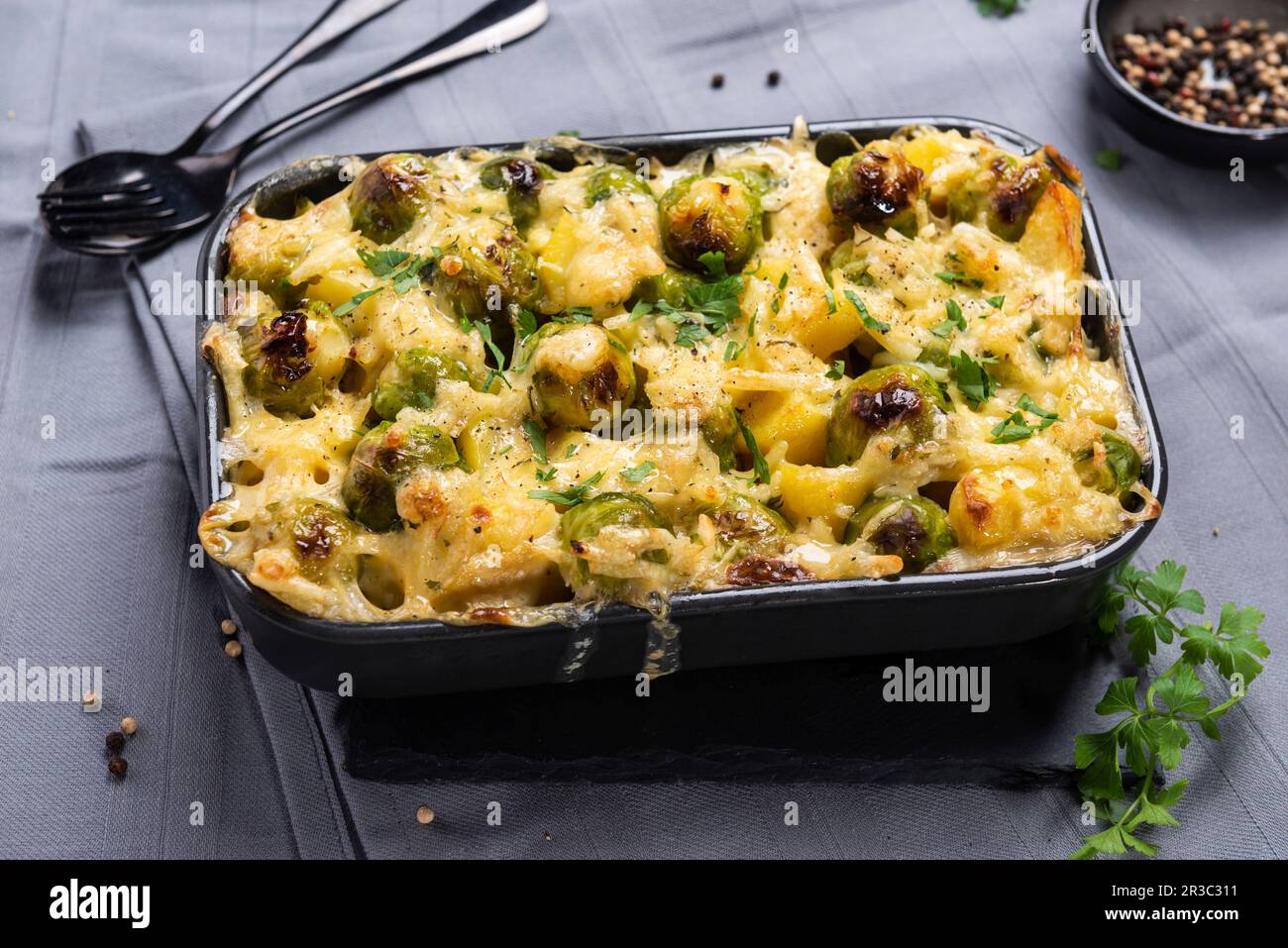 Vegan potato and Brussels sprouts bake, gratinated with almond cheese ...
