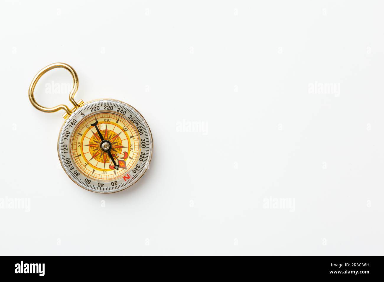Antique golden compass isolated on white background Stock Photo - Alamy