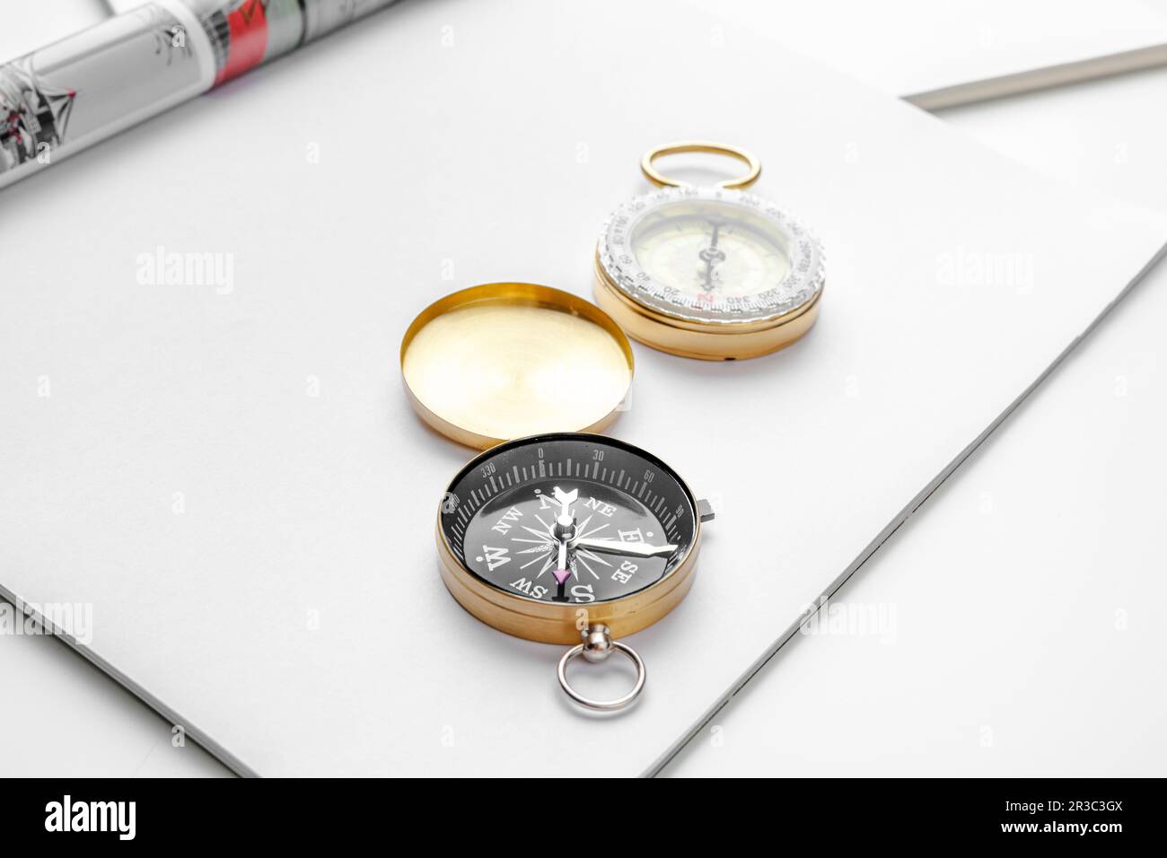 Nautical compass and empty magazine pages with copy space Stock Photo ...