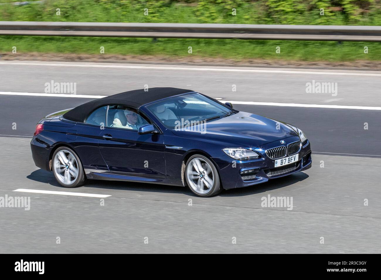 2013 BMW 640D M Sport Auto Cabrio; travelling on the M61 motorway UK Stock Photo - Alamy