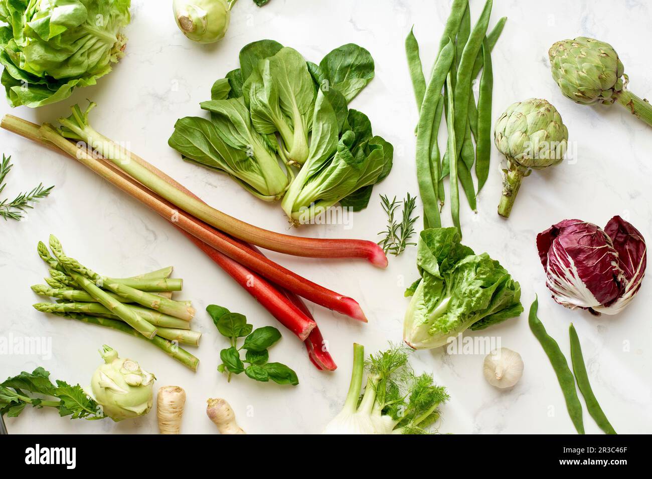 Various vegetables on a marble countertop Stock Photo - Alamy